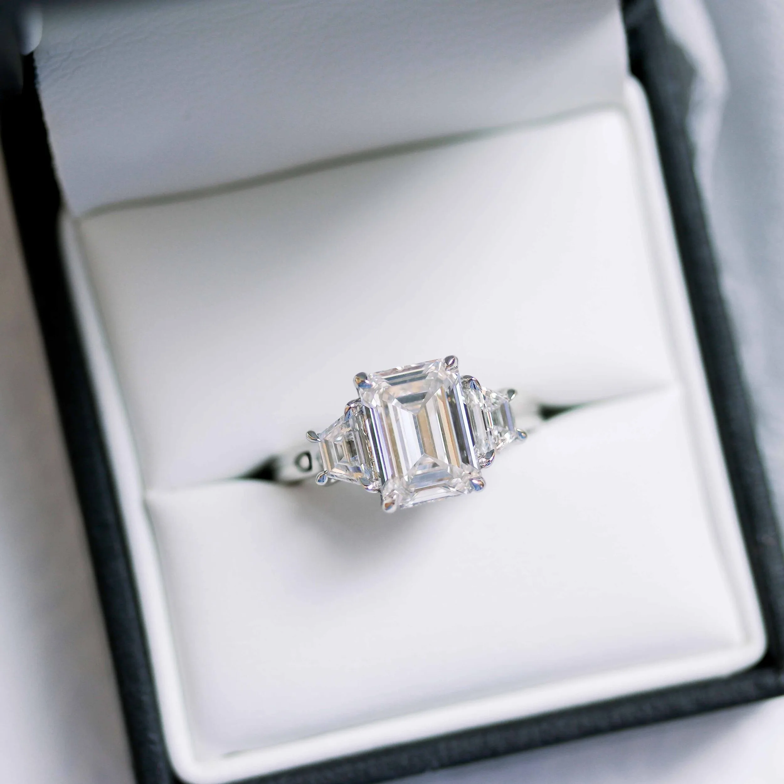 Emerald and Trapezoid Diamond Engagement Ring